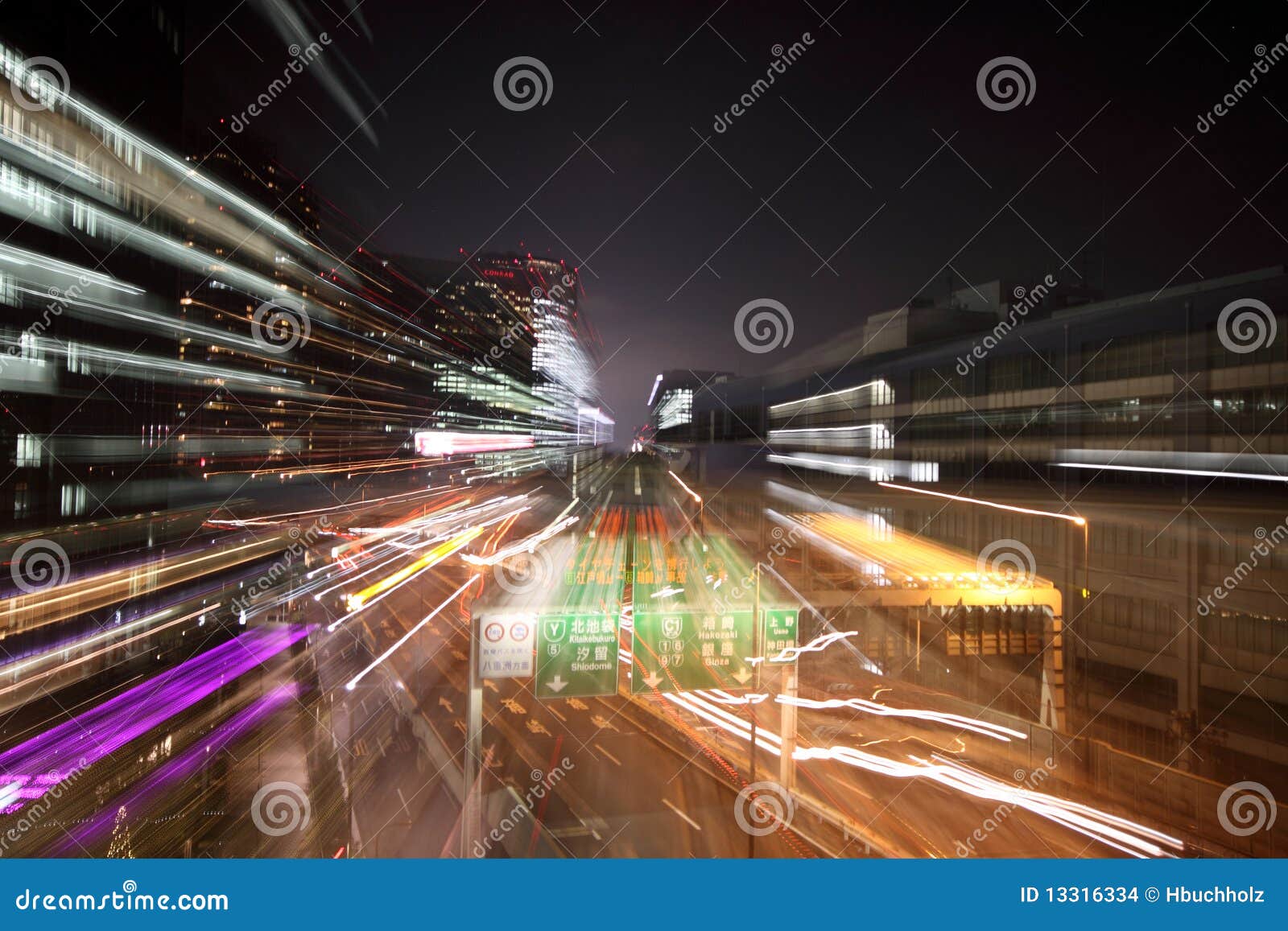 Zoom in on Highway and Illuminated Buildings Stock Photo - Image of ...
