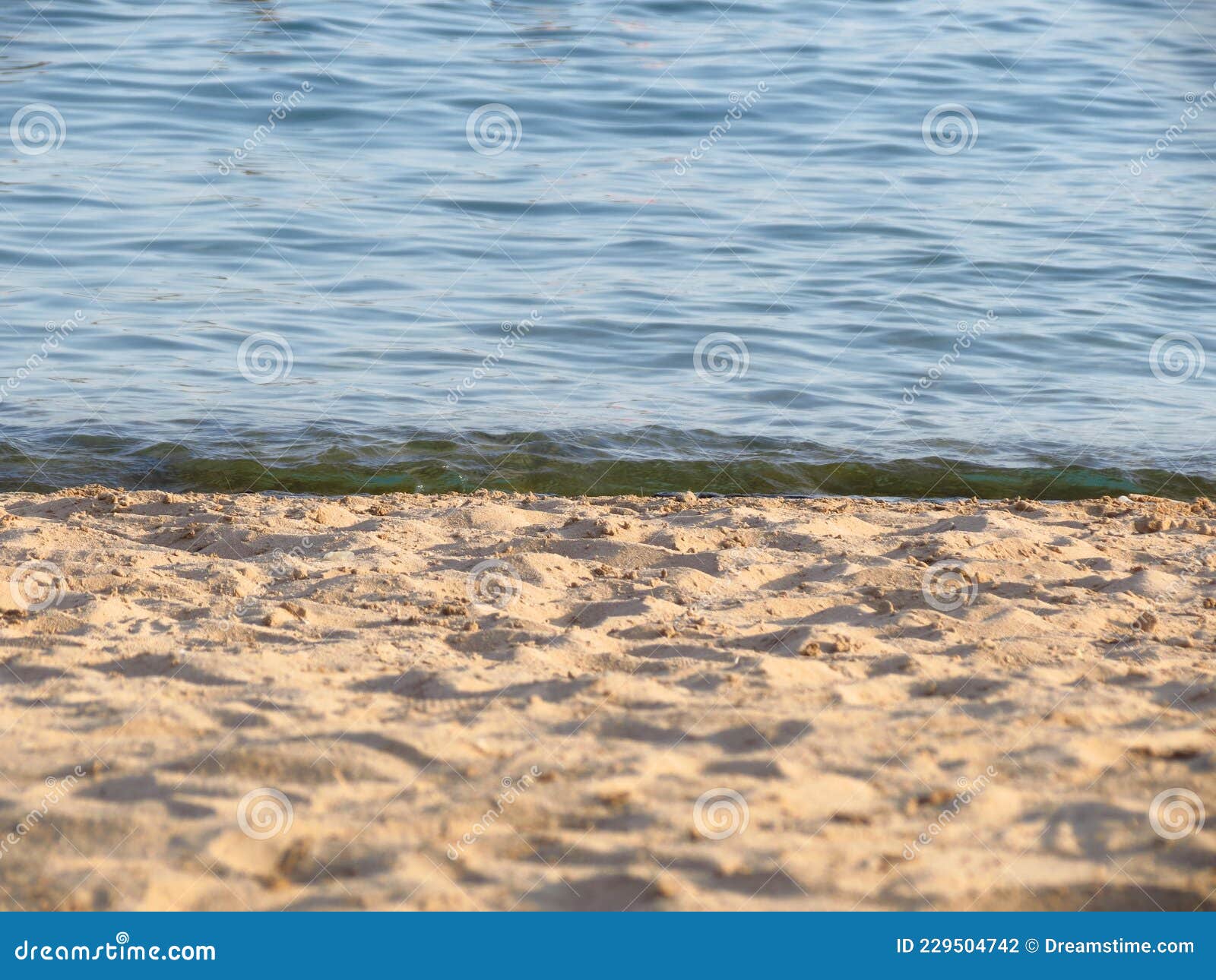 Zoomed in sea and sand stock photo. Image of nature - 229504742