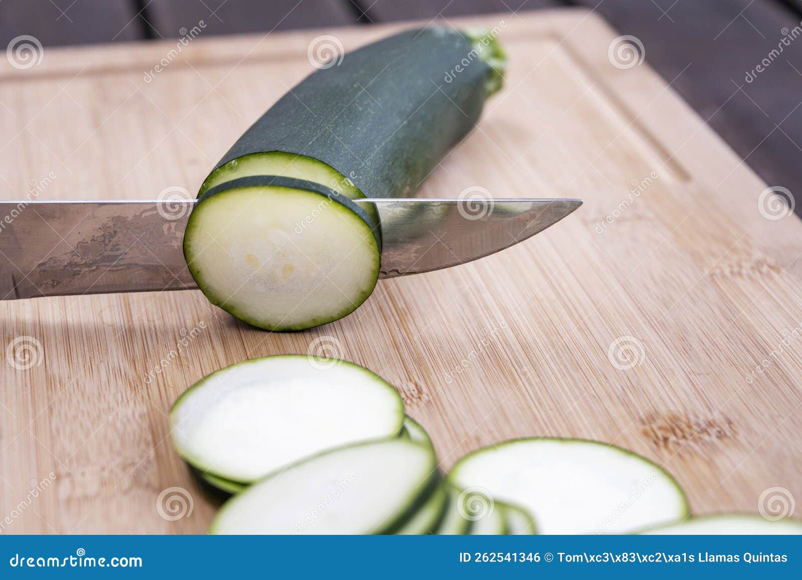 Zucchini Sliced with a Sharp Knife on a Bamboo Board Stock Photo ...